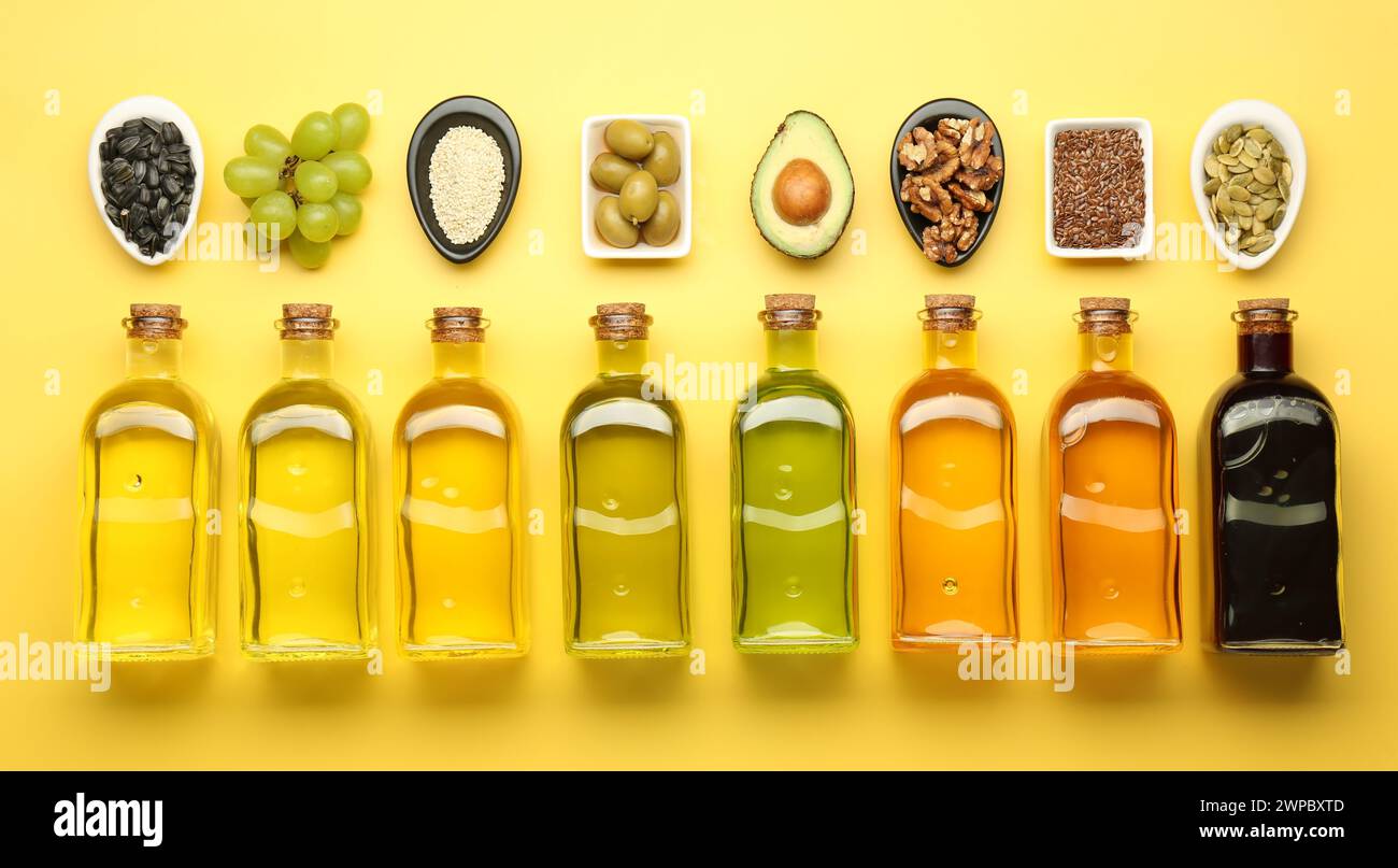 Vegetable fats. Different oils in glass bottles and ingredients on ...