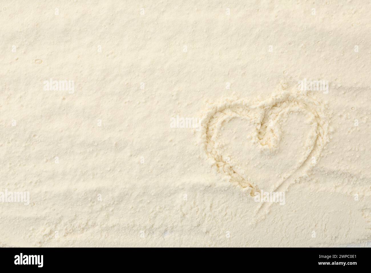 Heart drawn on baking powder, top view. Space for text Stock Photo - Alamy