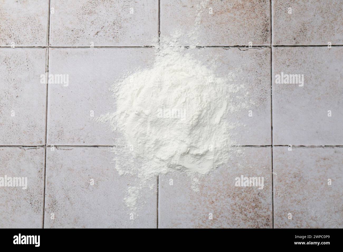Pile of baking powder on light tiled table, top view Stock Photo - Alamy