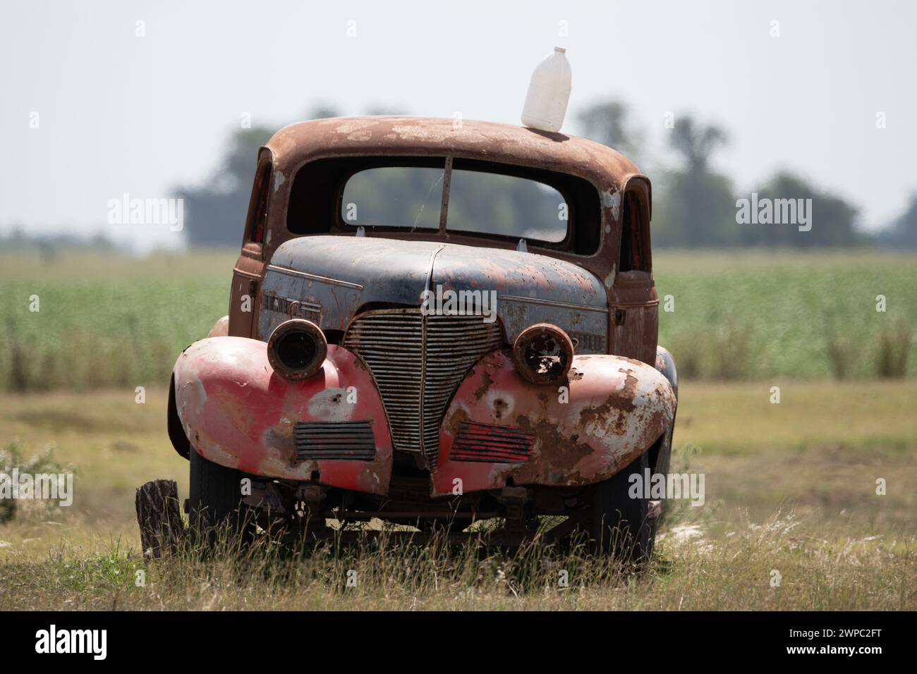 Very old rusty car for sale Stock Photo - Alamy
