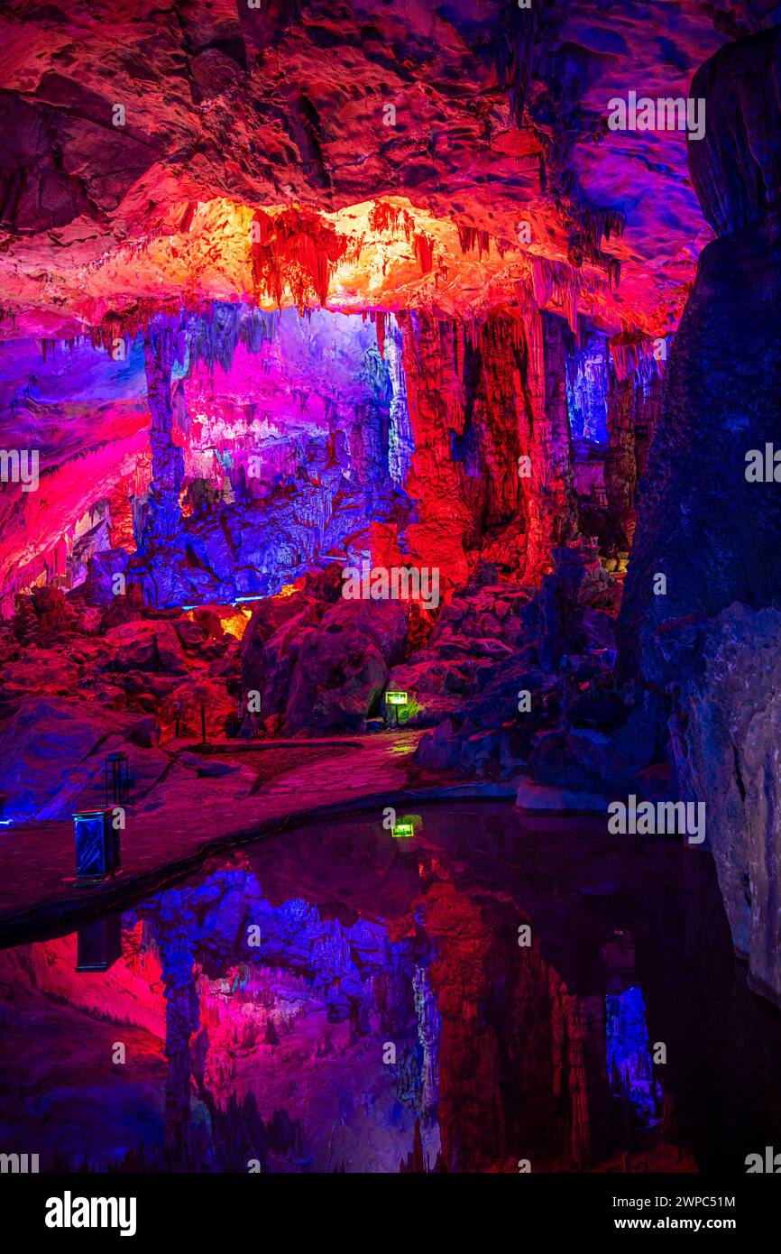Underground lake in Reed Flute Caves in Guilin, China. Vertical ...