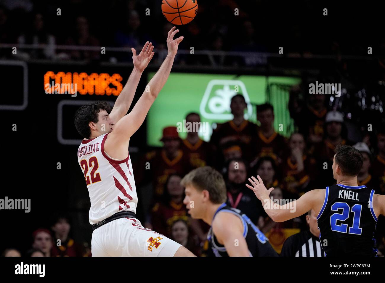 Iowa State forward Milan Momcilovic (22) shoots over BYU guard Trevin ...