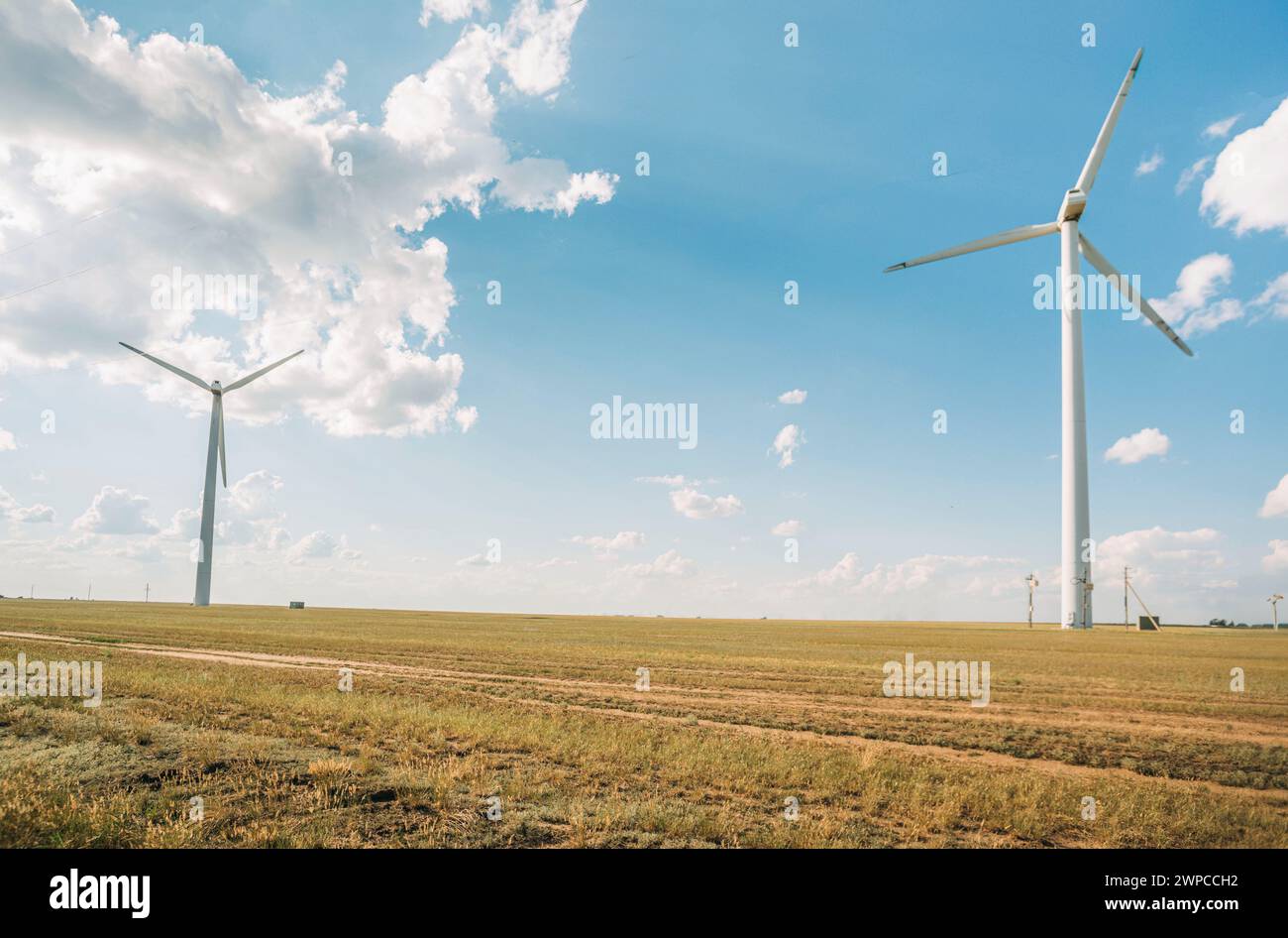 Panoramic over beautiful meadow field farm landscape, wind turbines to ...