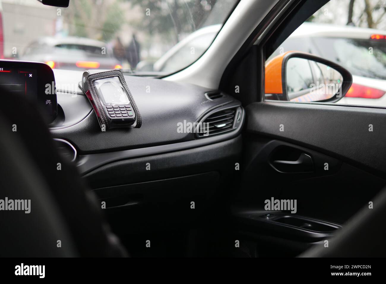 POS machine on yellow taxi Stock Photo - Alamy