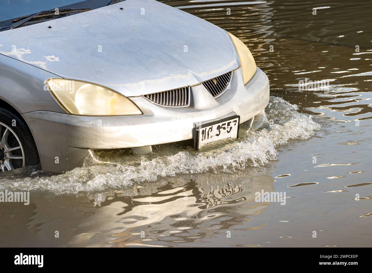 Car moving flooded street hi-res stock photography and images - Alamy