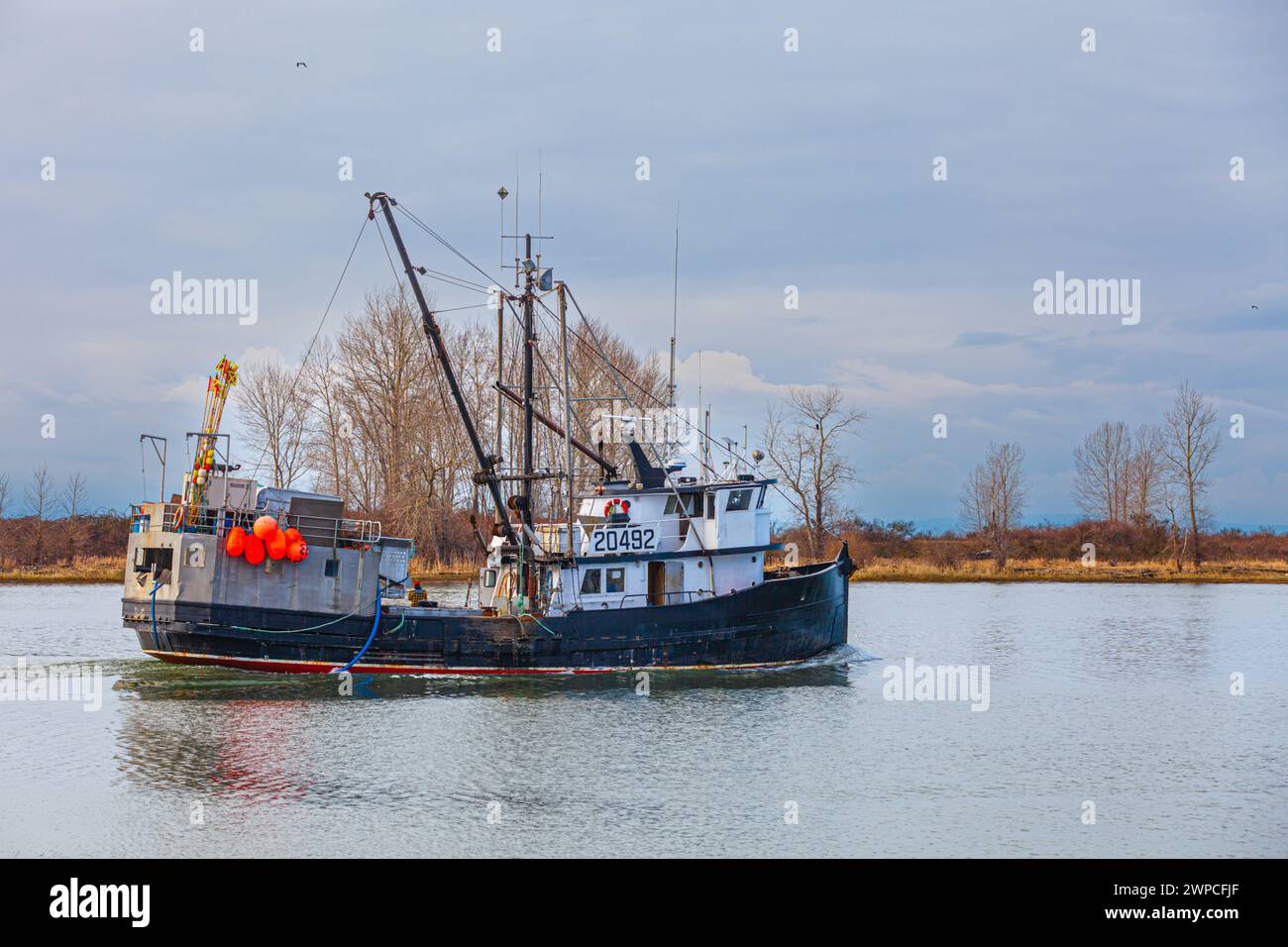 Wooden hulled commercial fishing vessel in Steveston channel British ...