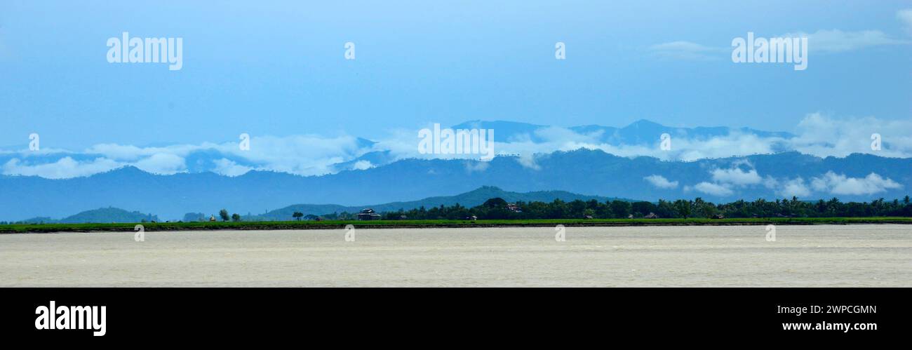 Misty mountains after a rainy morning seen from the Kaladan river in ...