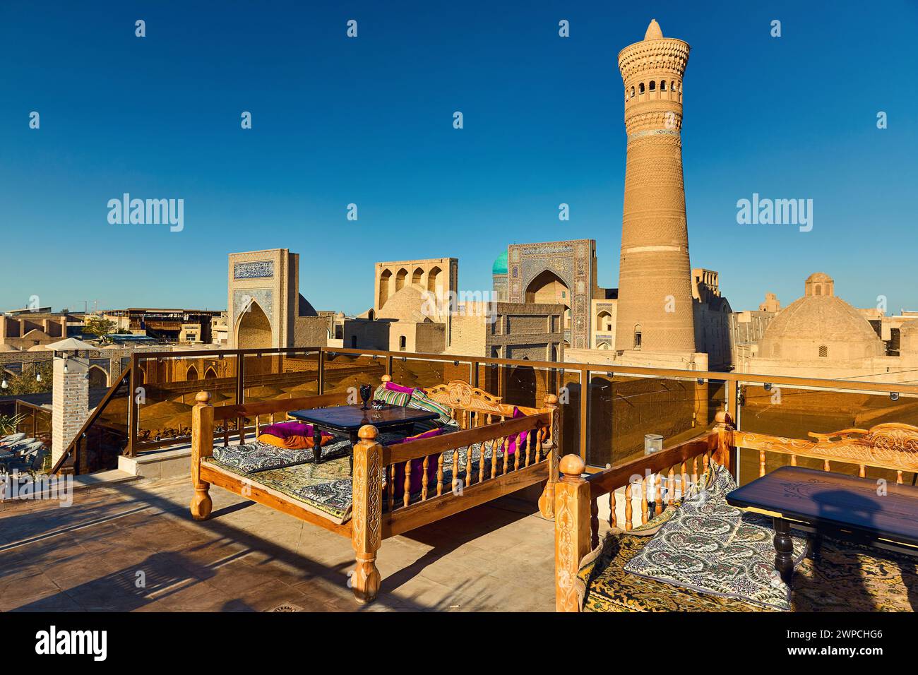 Roof top restaurant with topchan table bed in Bukhara near Kalyan ...