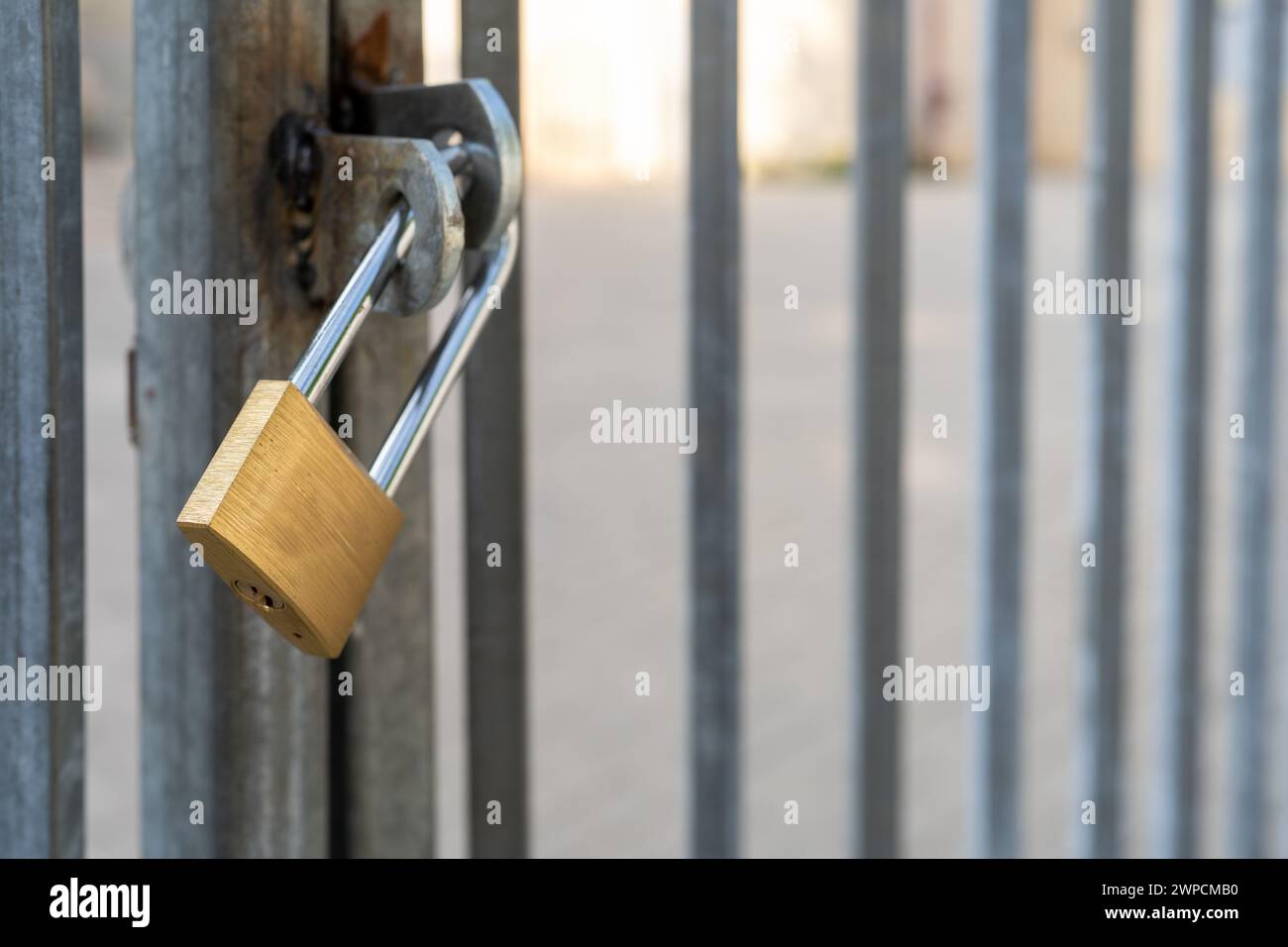 Metallic Gate With A Shiny Padlock Captures Urban Security On A Quiet ...