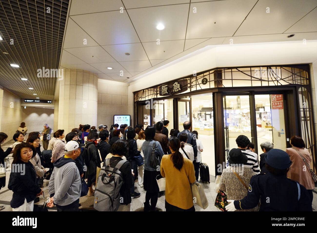 Japanese crowed waiting for a shop to open in Kobe, Japan Stock Photo ...