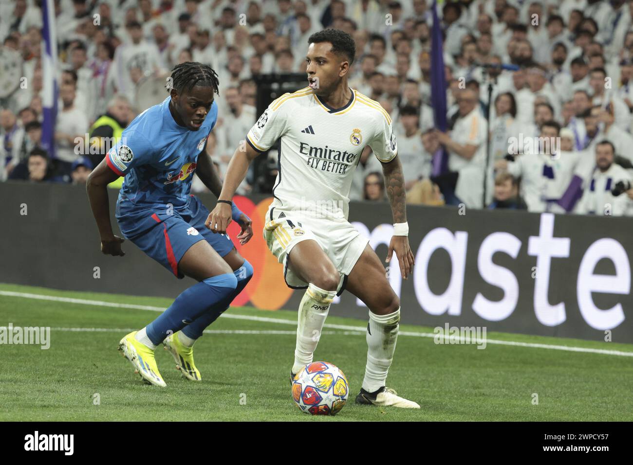 Rodrygo of Real Madrid, left Castello Lukeba of RB Leipzig during the ...