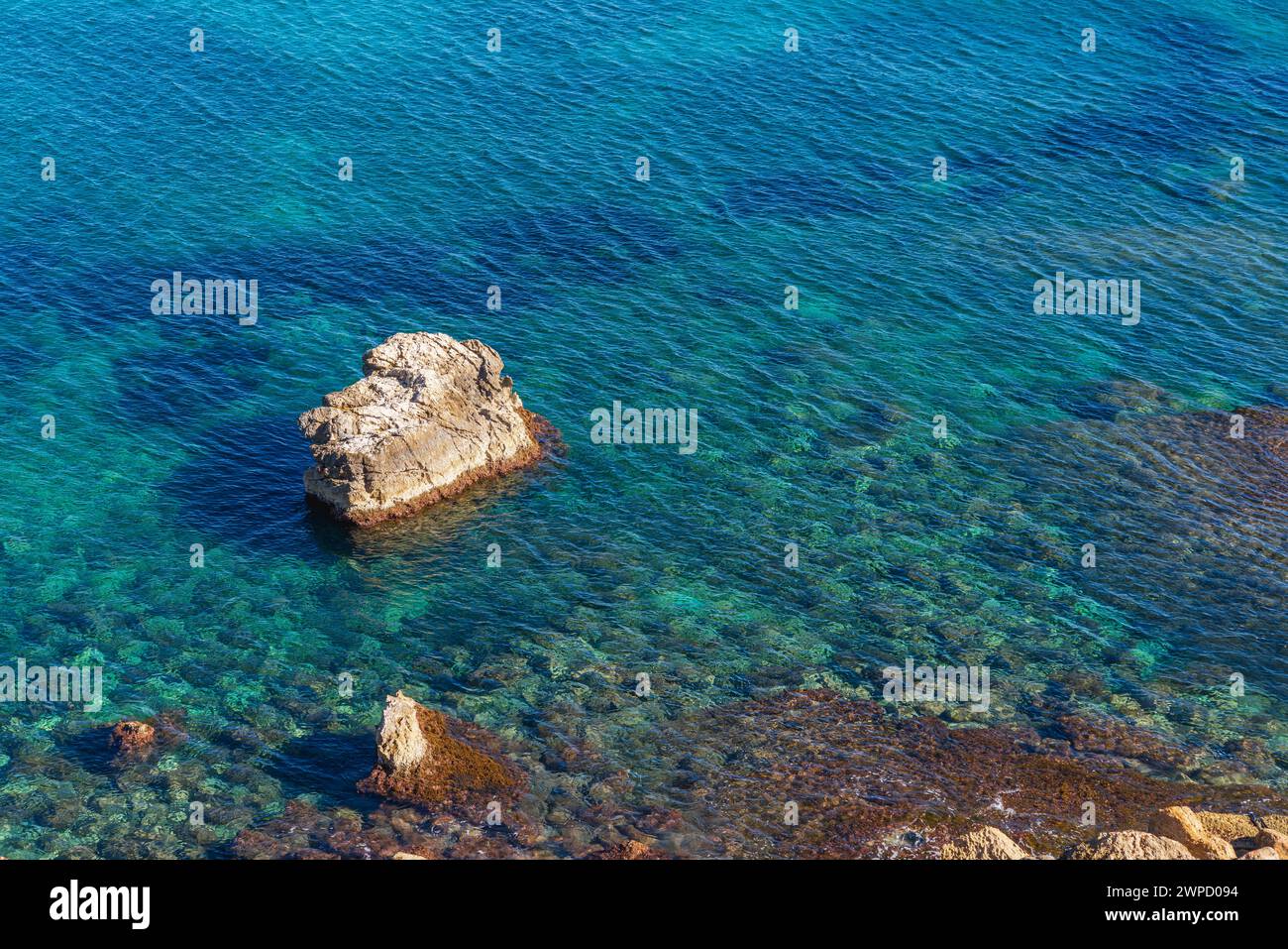Elevated view of the sea with turquoise and clean water and some rocks ...