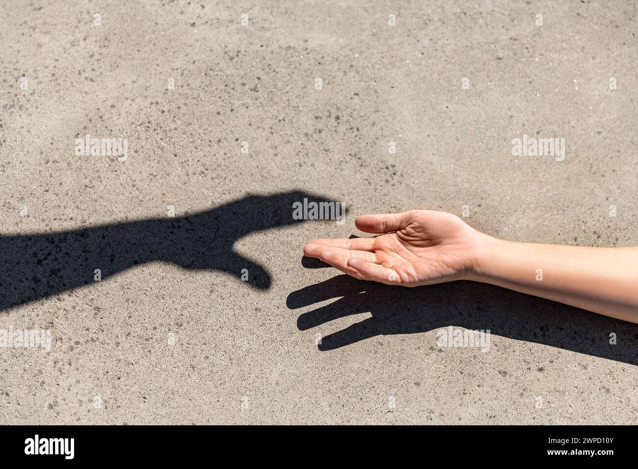 close up of human hand reaching to shadow Stock Photo - Alamy