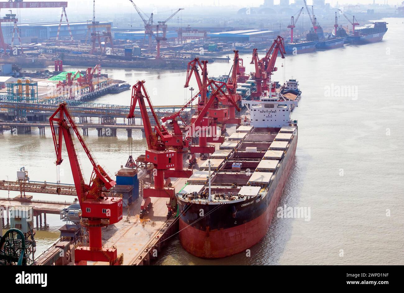 TAIZHOU, CHINA - MARCH 7, 2024 - Grain loading and unloading operations ...