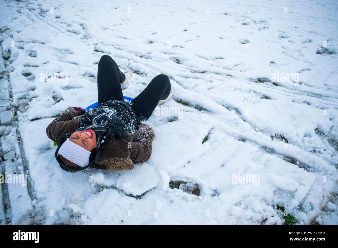 A Filipino Female Having Fun Sledging for the first time in the UK Snow ...