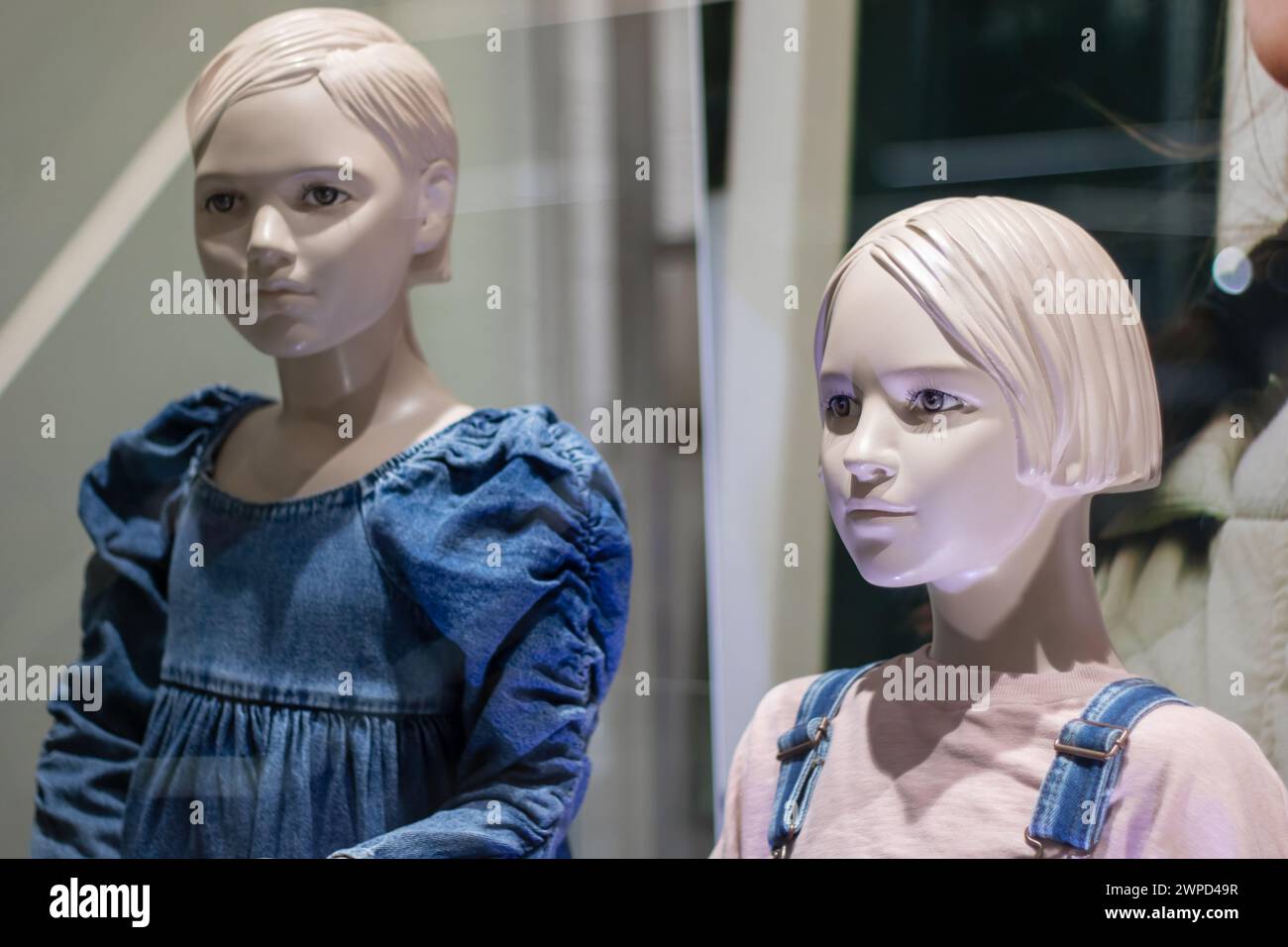 Baby mannequin in bright clothes in store close up Stock Photo - Alamy