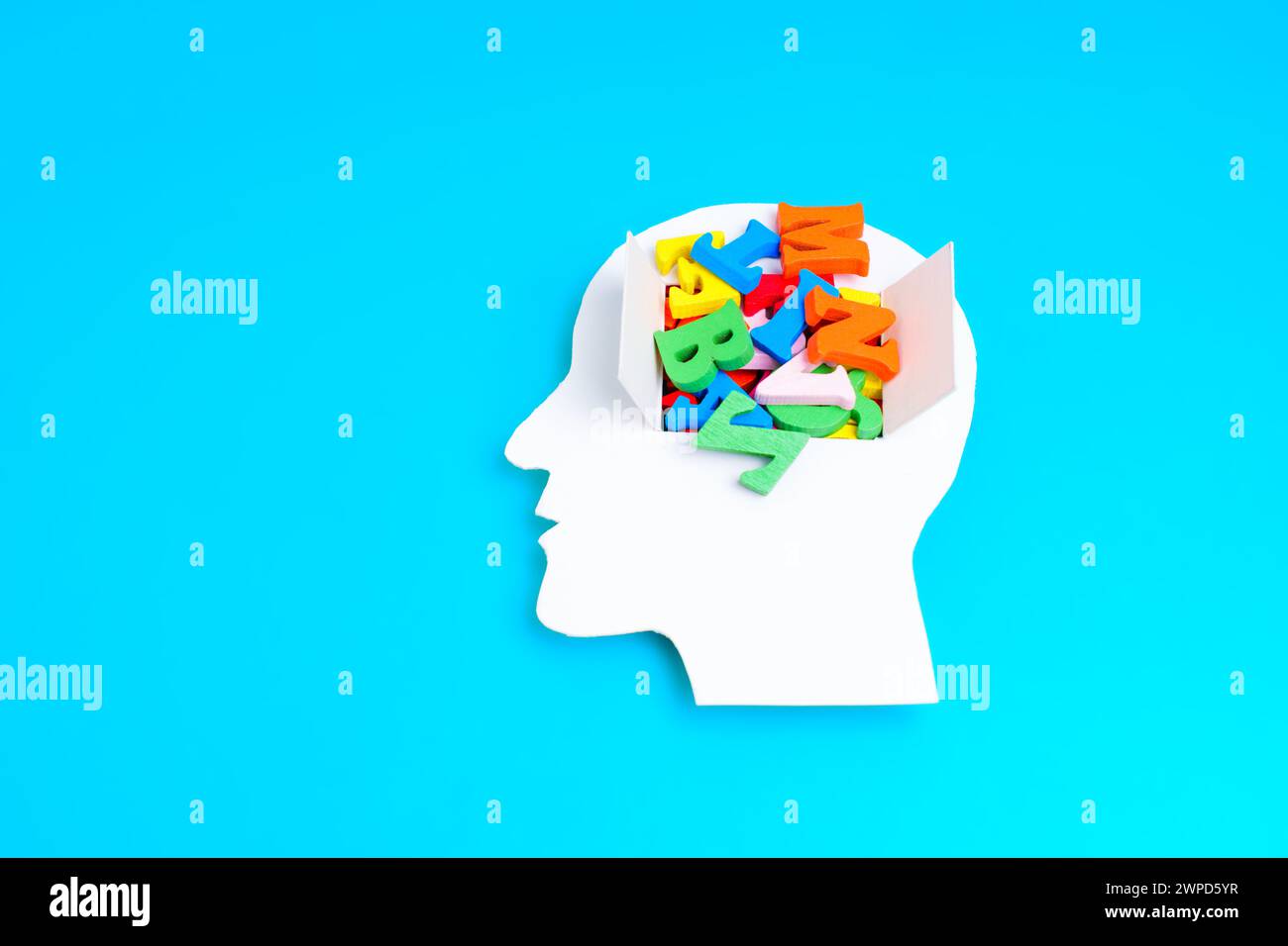 White paper-cut human head reveals an open window, from which an array ...