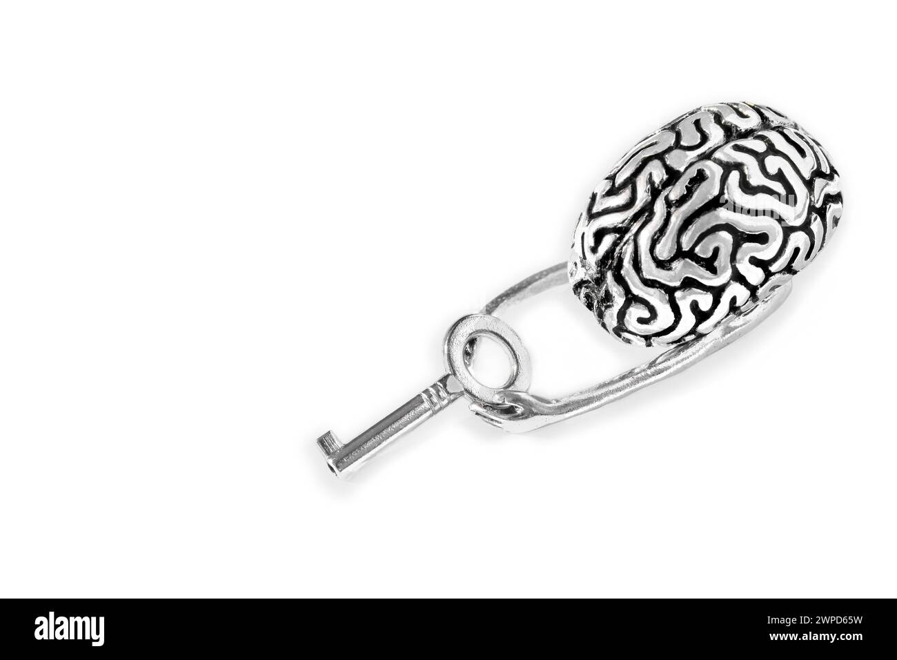 Steel human brain model holds a key in its hands isolated on white ...