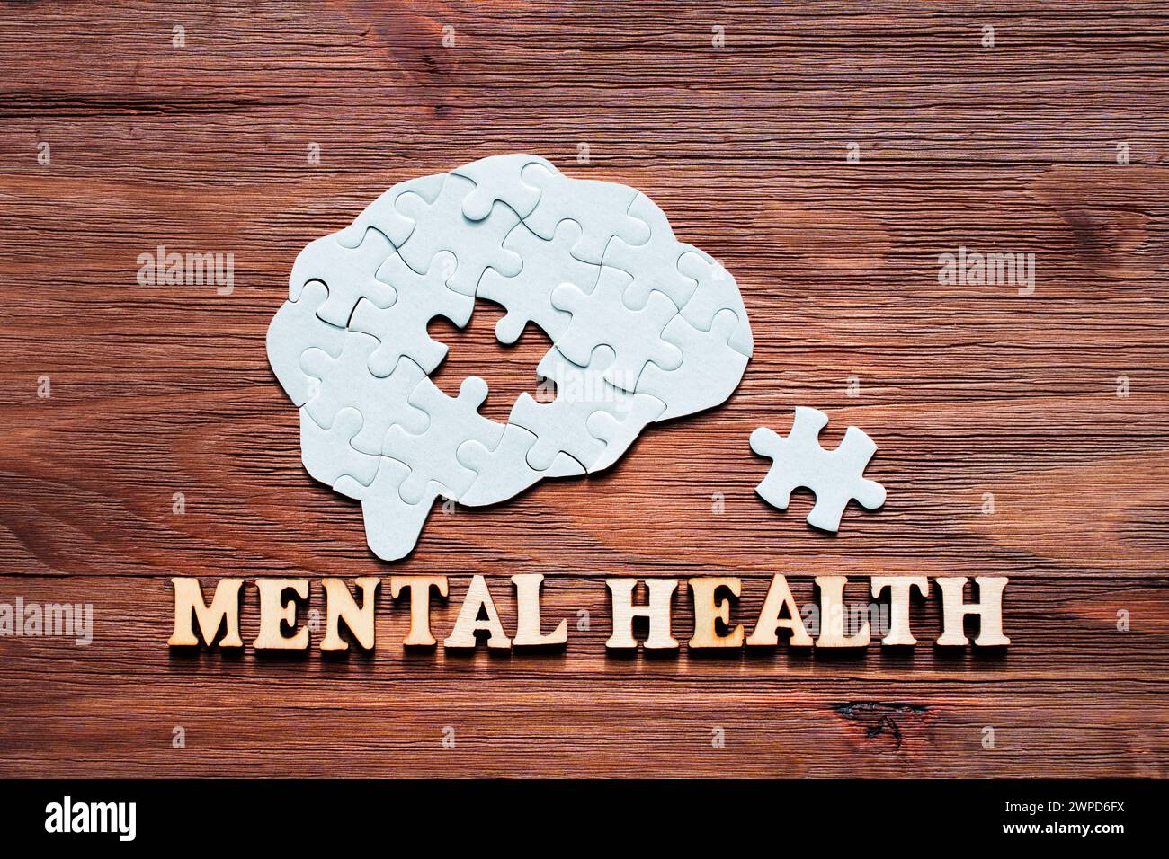 Lettering "Mental Health" made of wooden letters placed under an ...