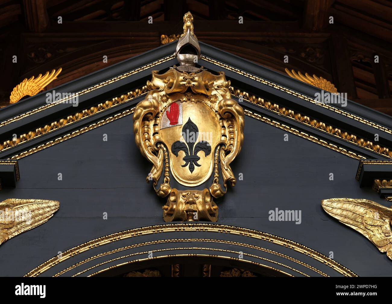 Gilded emblem on the screen between the antechapel and the chancel in ...