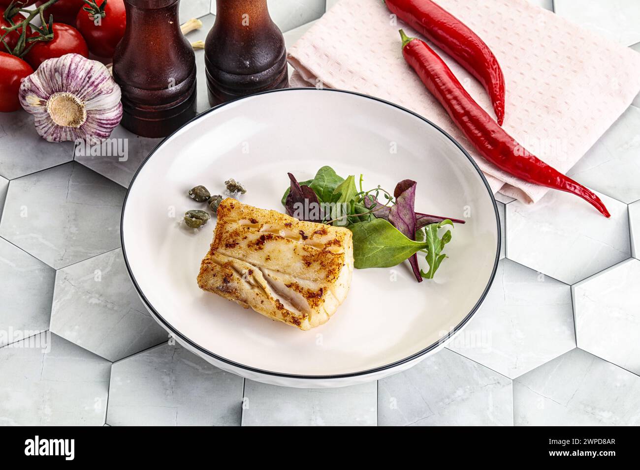 Roasted cod fish steak with salad leaves Stock Photo - Alamy