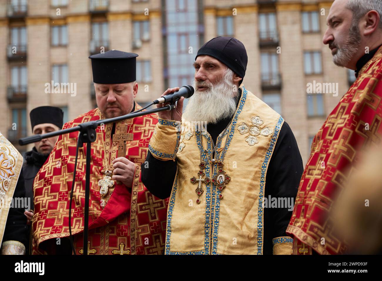 Priest of Orthodox Church of Ukraine says a prayer on a memorial ...