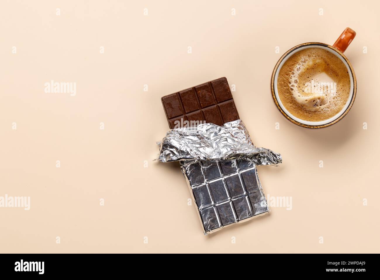 Coffee break bliss: Chocolate bar paired with a cup of coffee. Flat lay ...