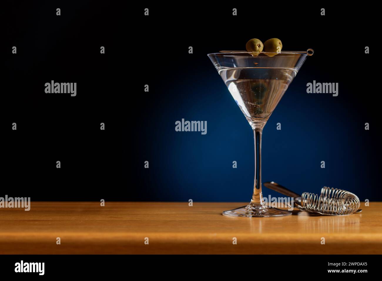 Cocktail allure: Classic martini cocktail on a bar table with copy ...