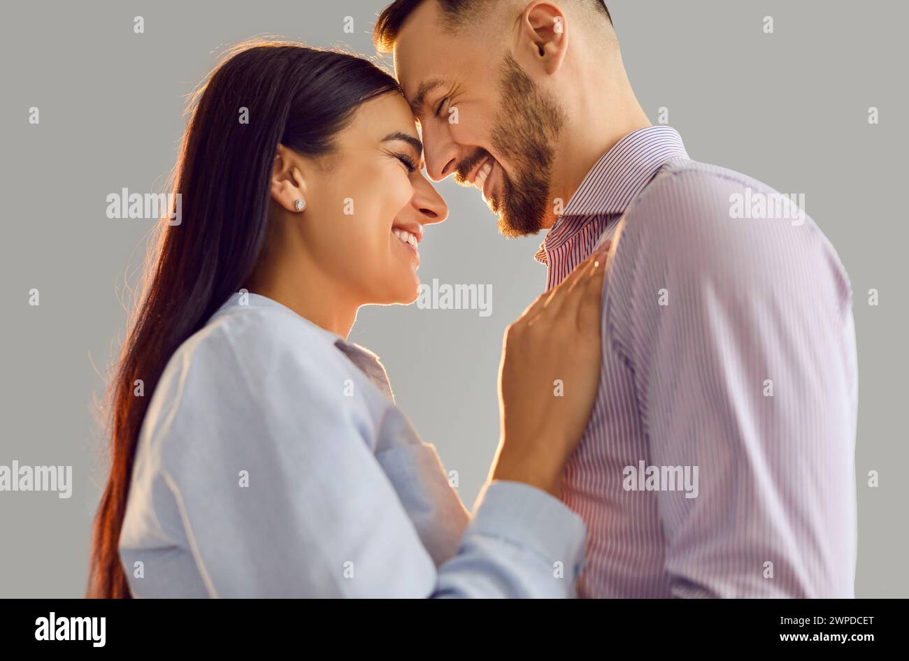 Happy people in love, man, woman standing close laughing in intimate ...
