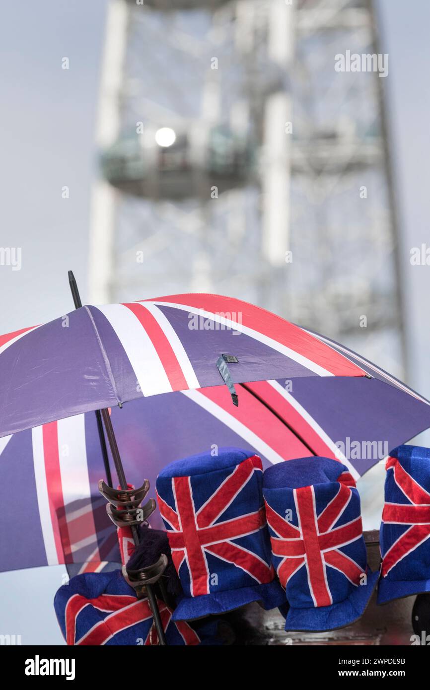 UK, London, Tourist union flag souvenirs with the millineum wheel in ...