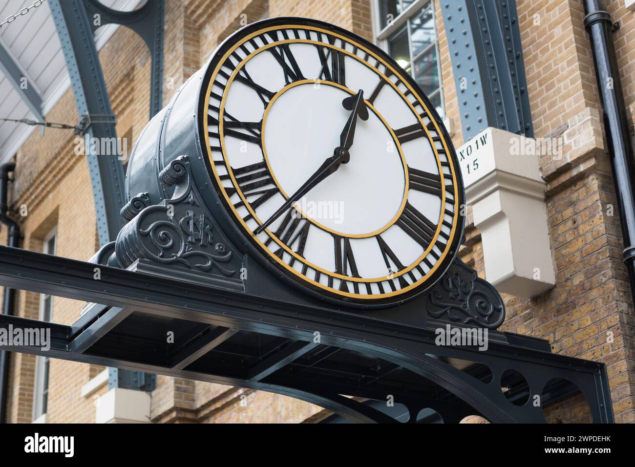 UK, London, large wall clock, Kings Cross train station Stock Photo - Alamy