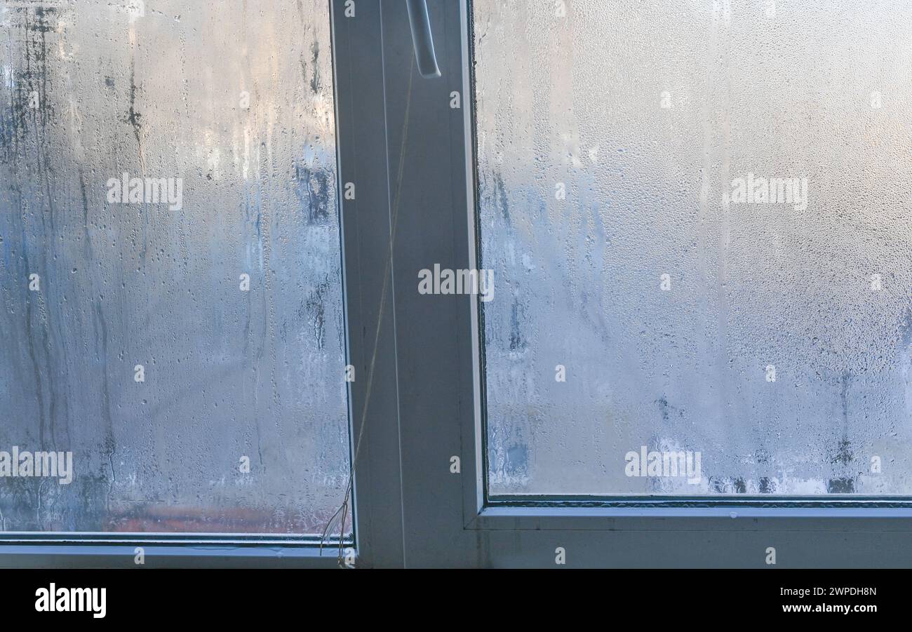 a wet window. the glass is fogged up due to high humidity Stock Photo ...