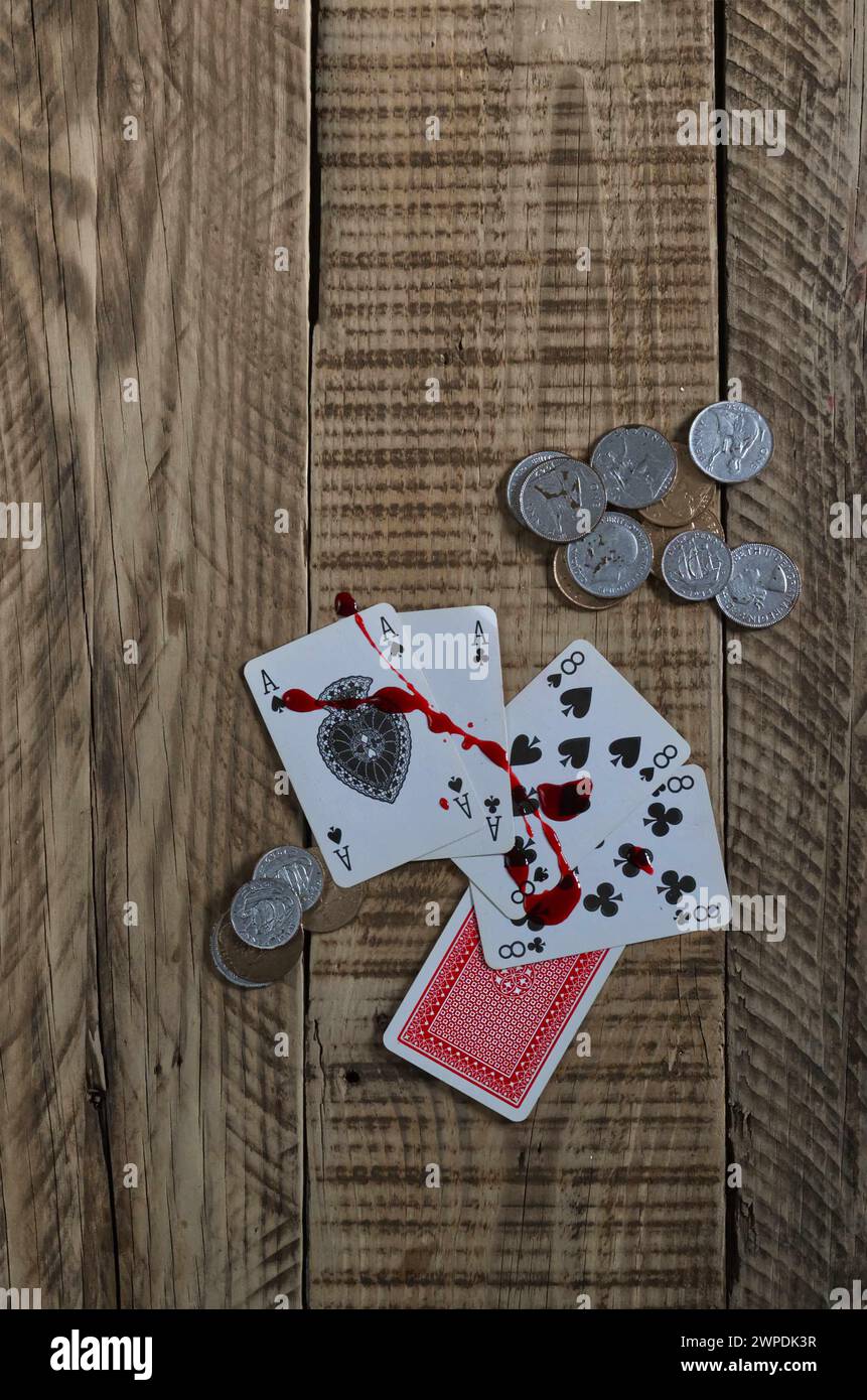 Dead mans hand playing cards aces and eights on wooded background. with ...