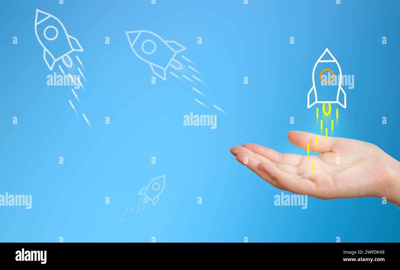Business hand with rocket launch. Initiation and progress of startups ...