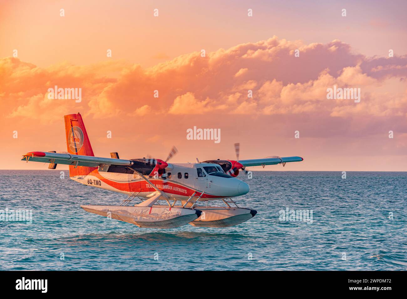 Exotic transportation vacation scene with seaplane on Maldives sea ...