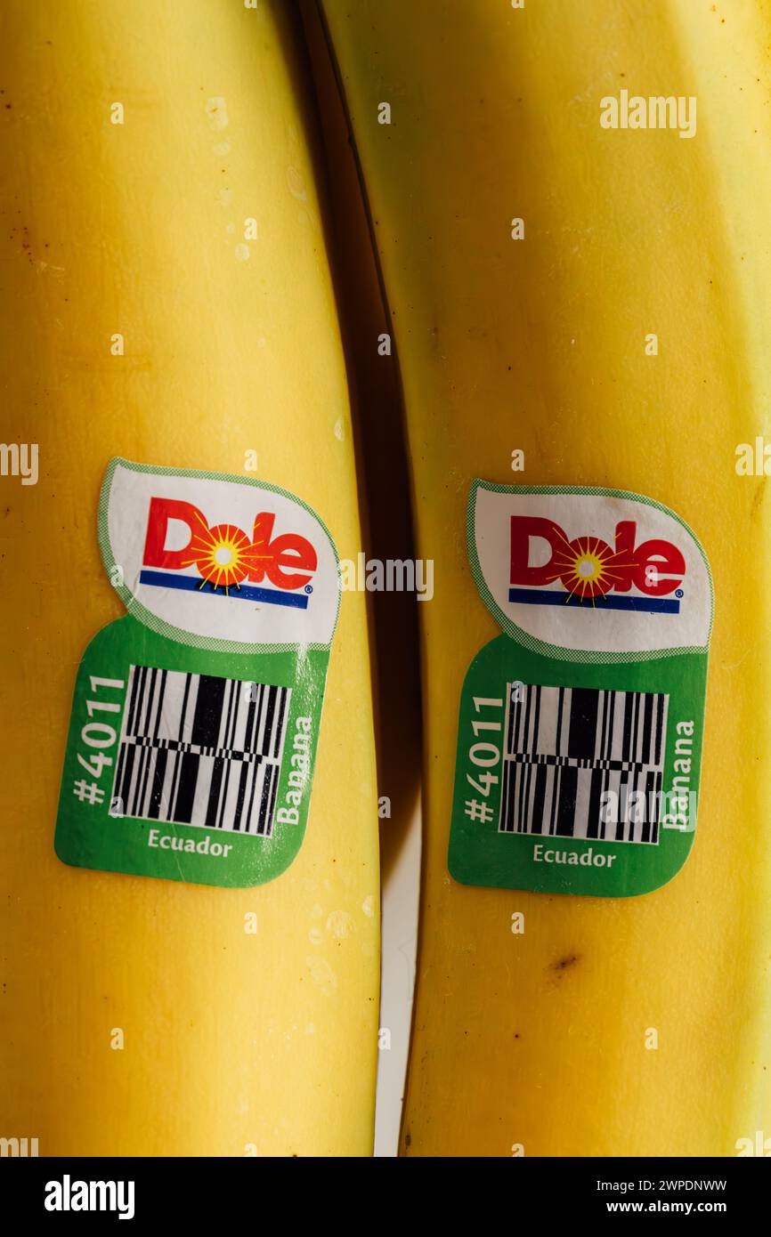 two yellow Dole bananas with PLU bar code sticker Stock Photo - Alamy