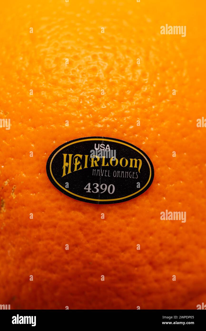 Heirloom sticker on navel orange Stock Photo - Alamy