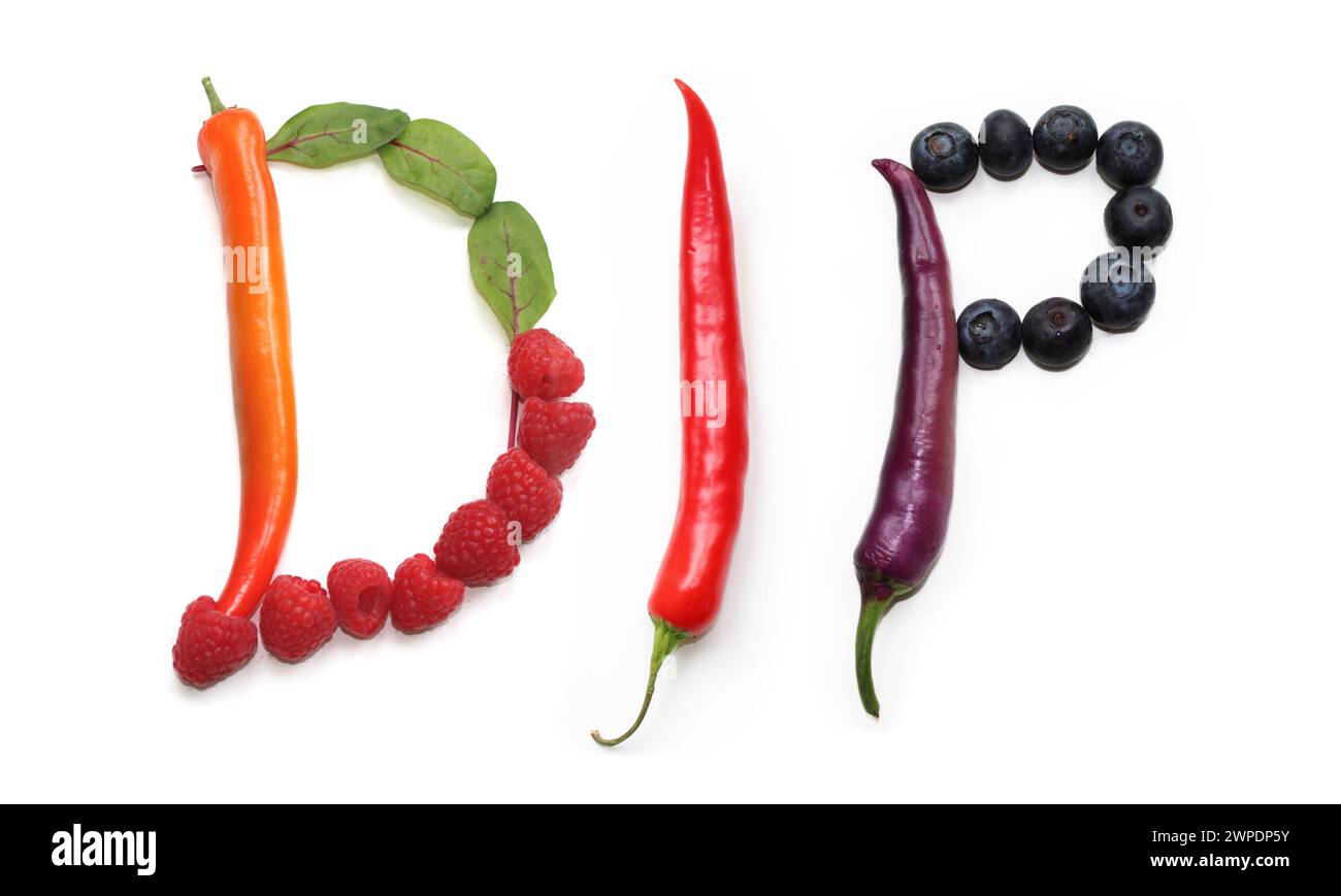 word DIP from purple red orange chili peppers, berries, raspberry, blueberry, green salad ...