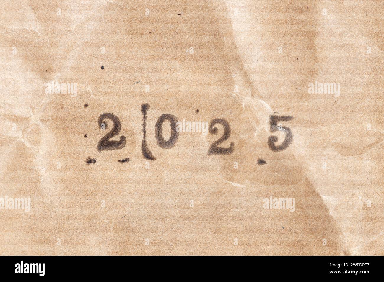 2025 ink rubber stamp on crumpled brown paper Stock Photo - Alamy