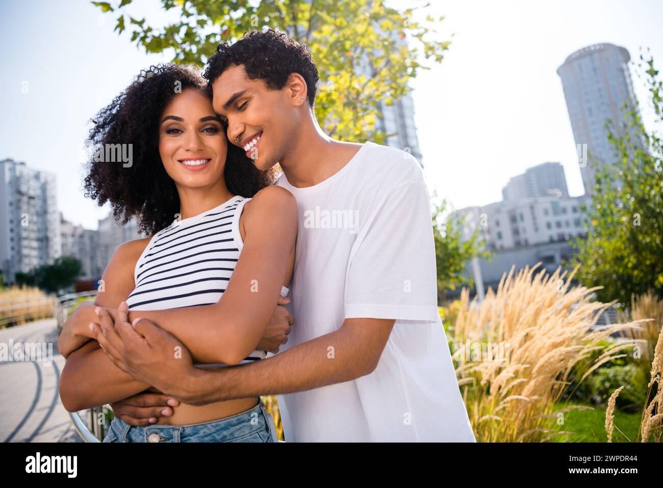 Photo of charming loving couple guy husband cuddle wife enjoy buying ...