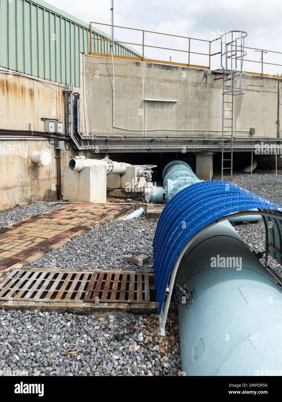 The large metal pipe with the check valve from the water filter plant ...