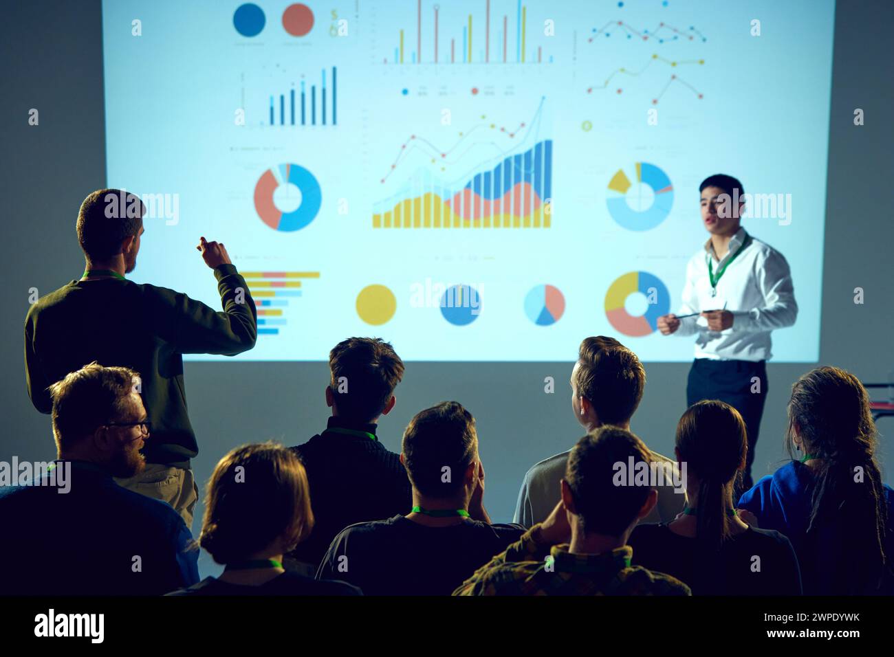 Educational seminar with an active audience, one person asking for ...