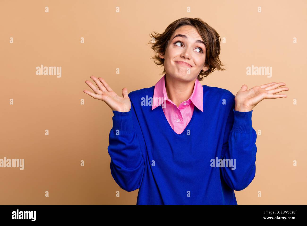 Photo portrait of lovely young lady shrug shoulders look empty space ...