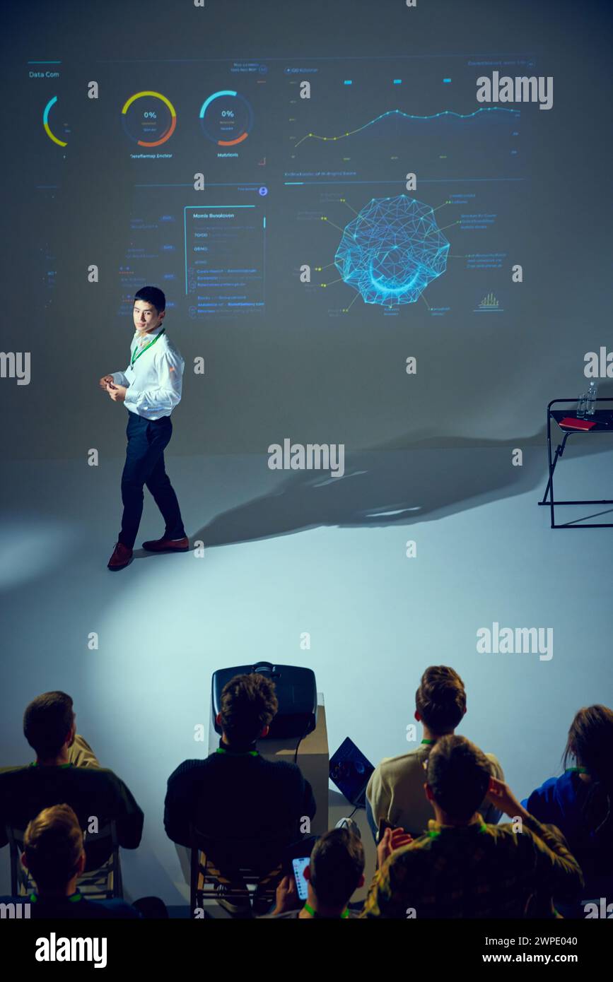 Technology seminar with Asian man presenter, speaker discussing complex ...
