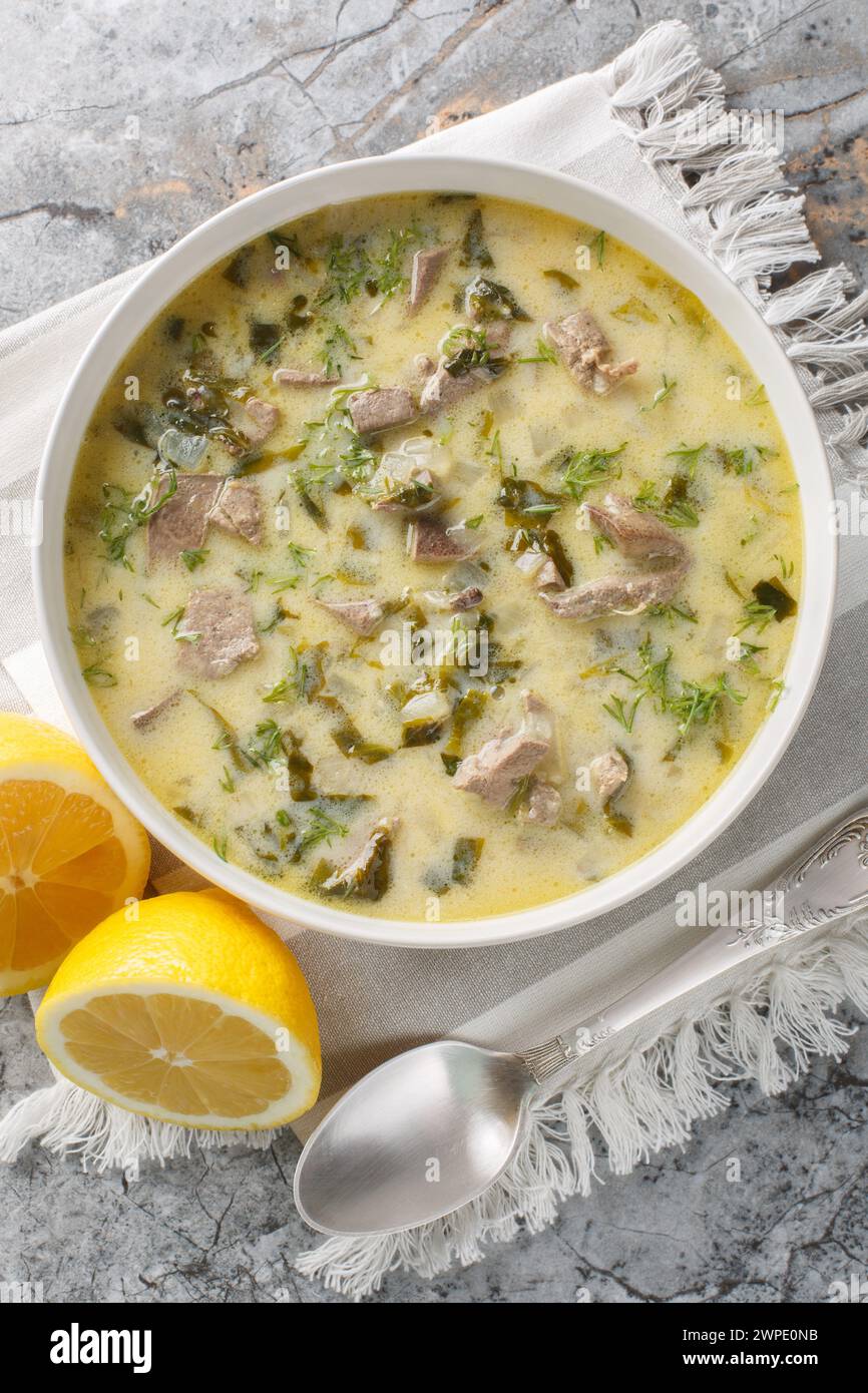 Tasty Greek Easter soup with lamb offal, herbs, seasoned with egg and ...