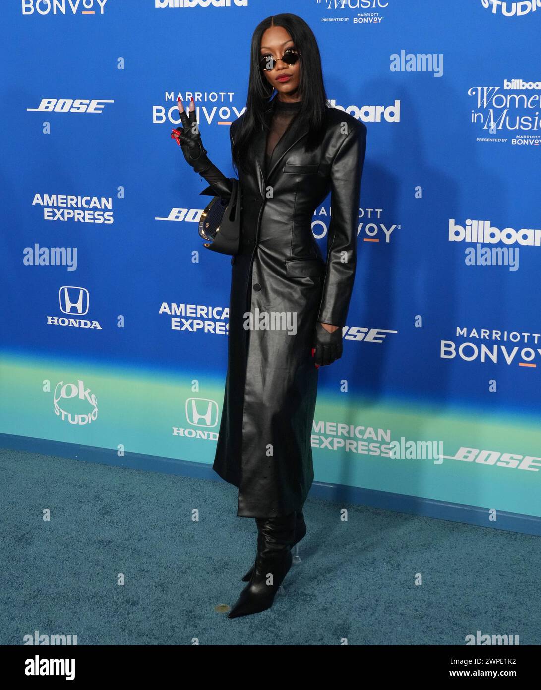 Muni Long arrives at the 2024 Billboard Women in Music Awards held at ...