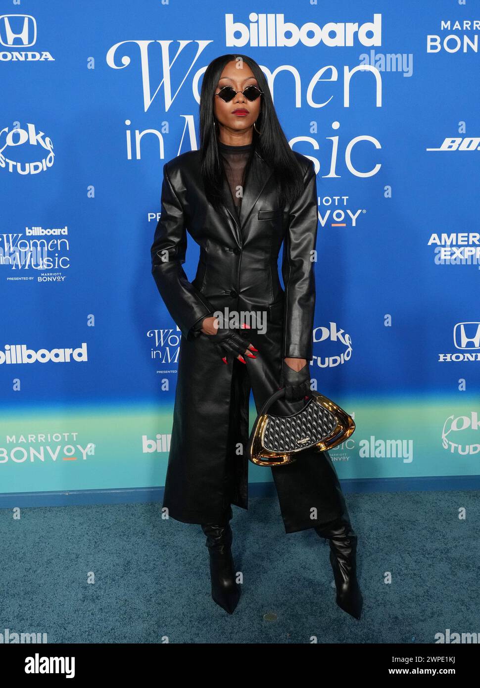 Muni Long arrives at the 2024 Billboard Women in Music Awards held at ...