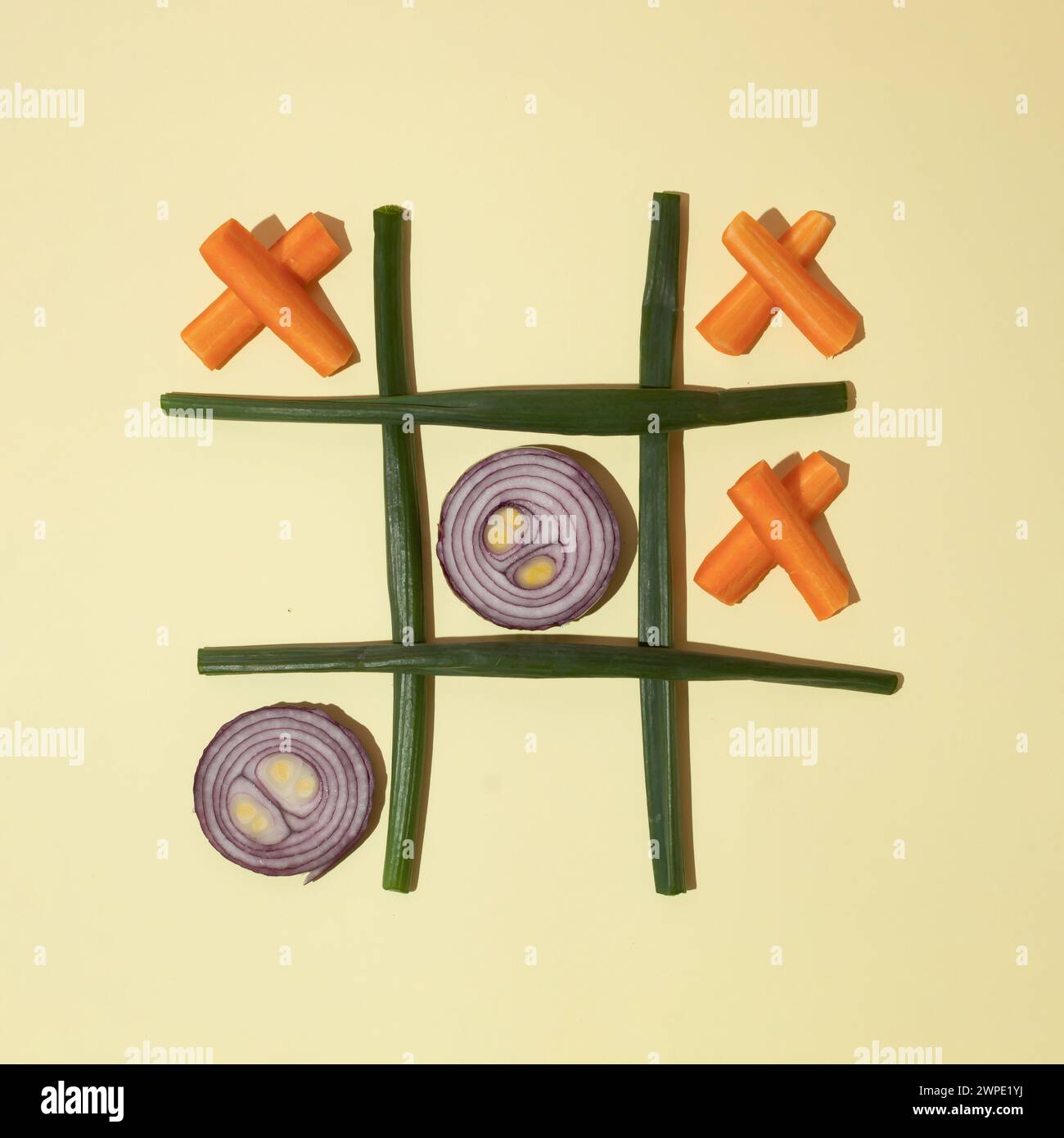 Onion and carrot tic tac toe. Flat lay. Healthy food concept Stock ...