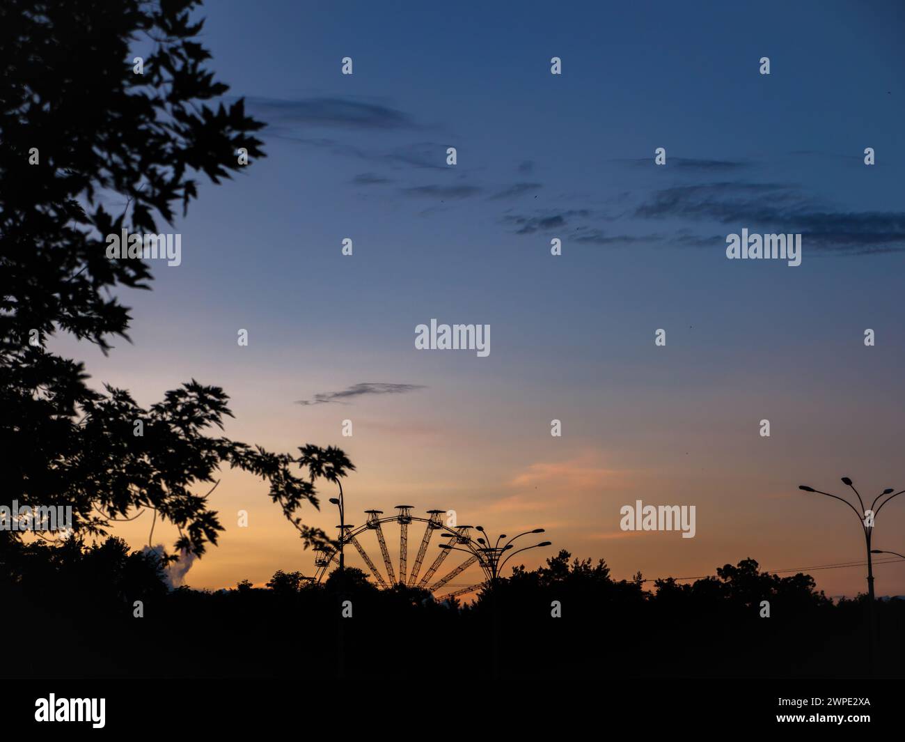 Big and high panoramic observation wheel on the horizon with colorful ...