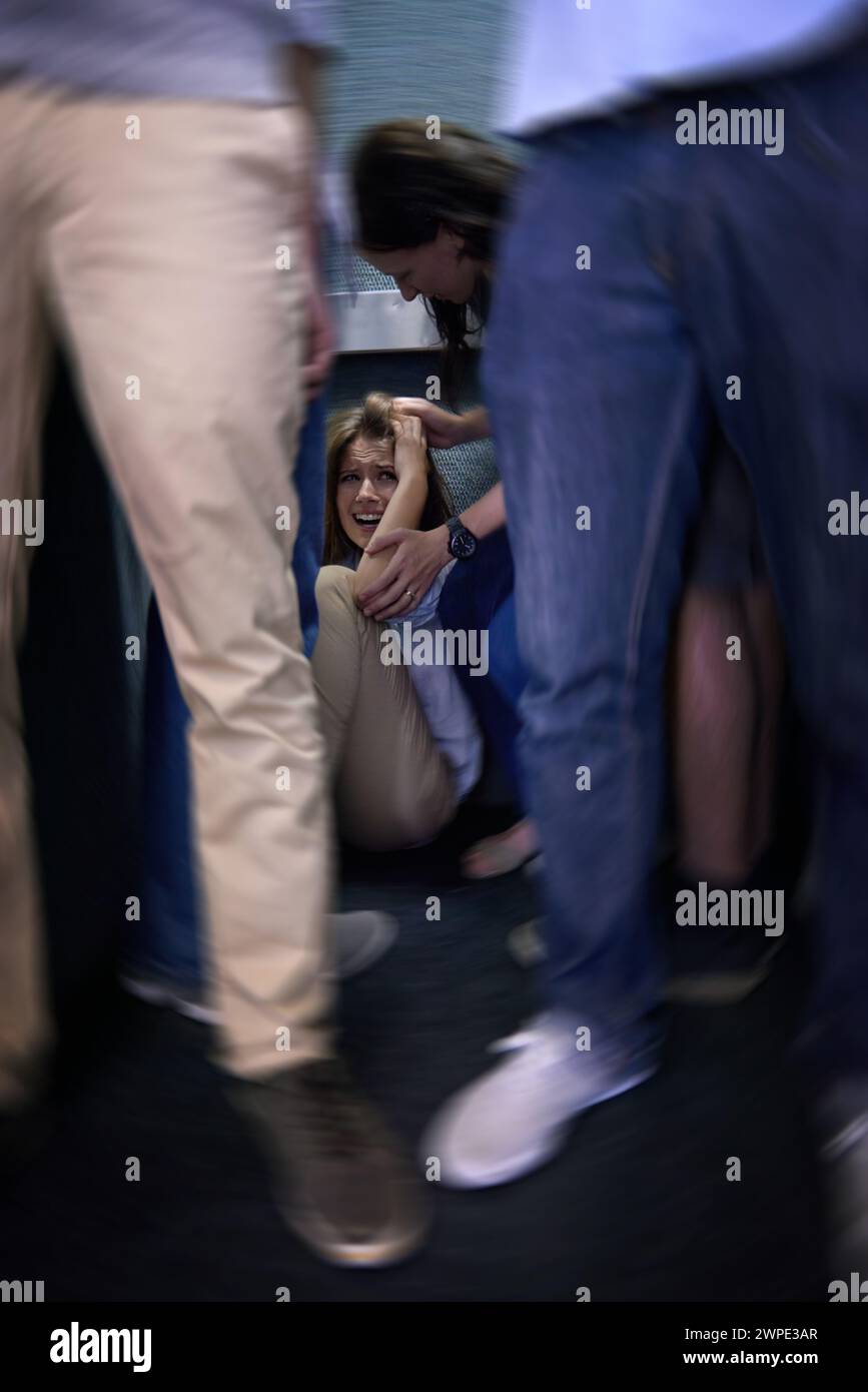 Crowd, female person and fear of social anxiety, screaming or crying in corner. Student, scared ...